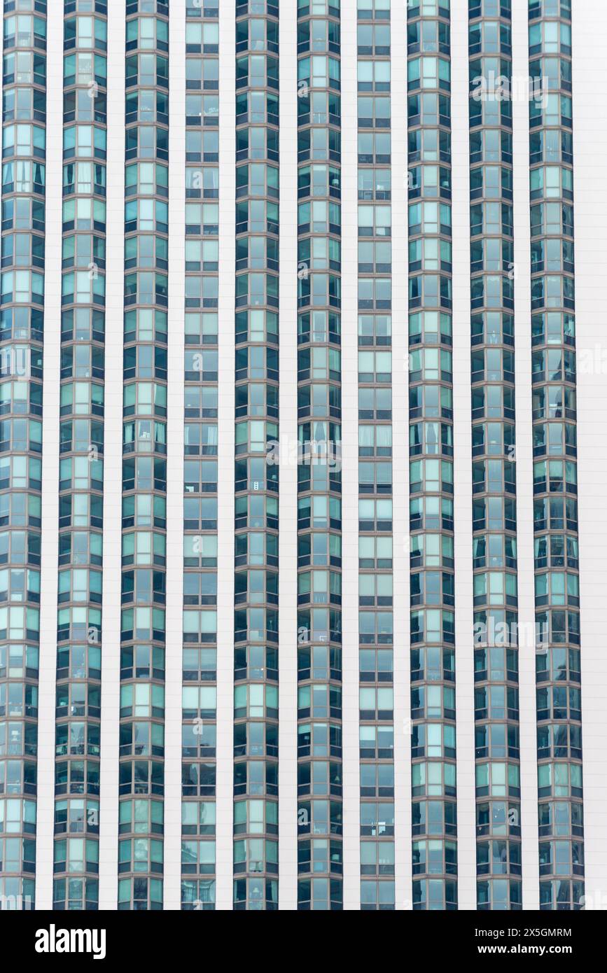 The building is very tall and has many windows. The windows are all the ...