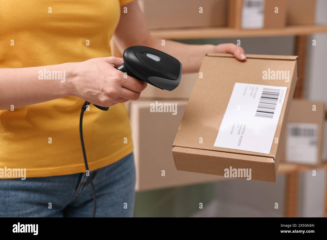 Woman scanner reading parcel hi-res stock photography and images - Alamy