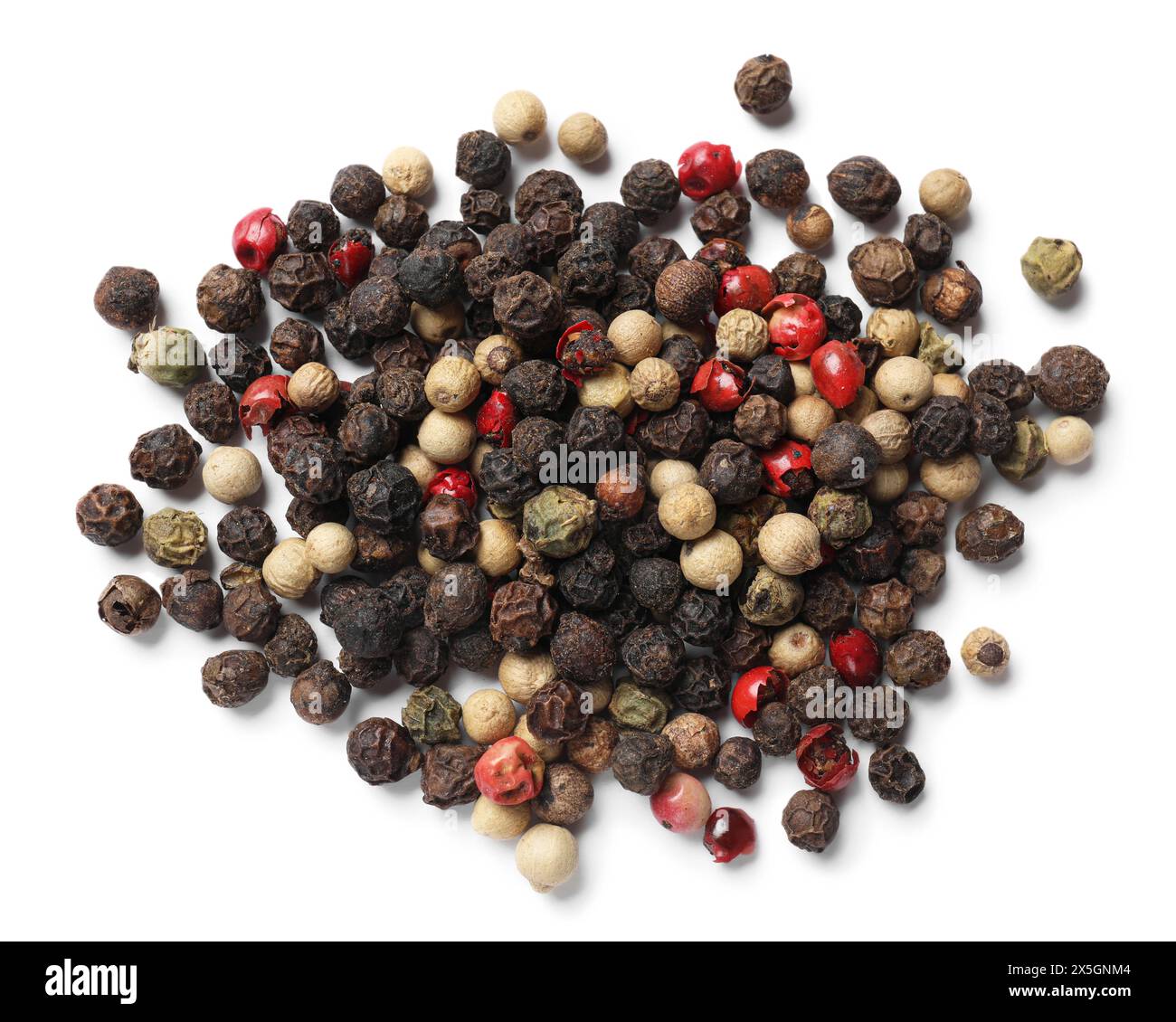 Aromatic spices. Pile of different peppers isolated on white, top view ...