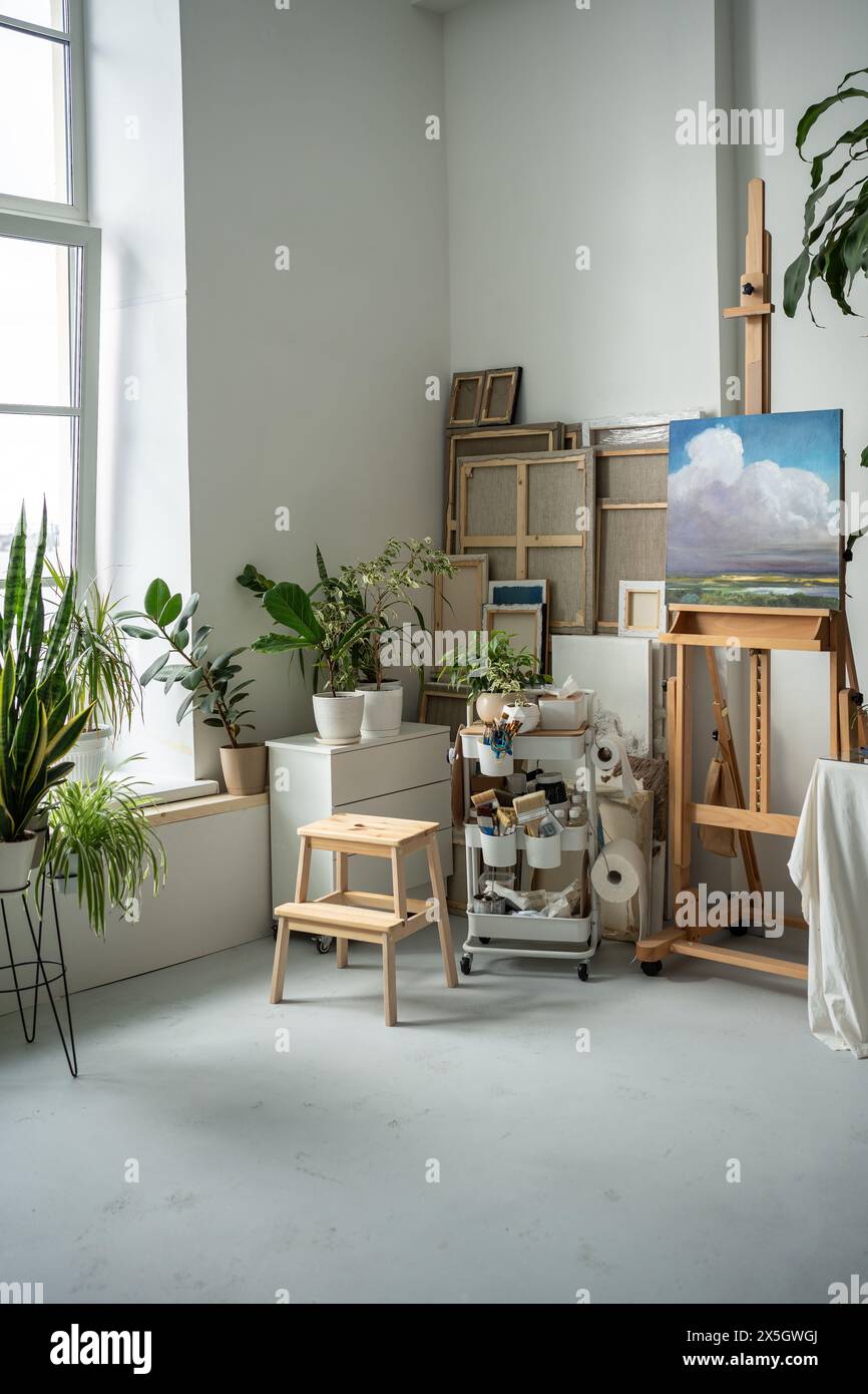 Brightly lit studio of professional artist, equipped with all necessary ...