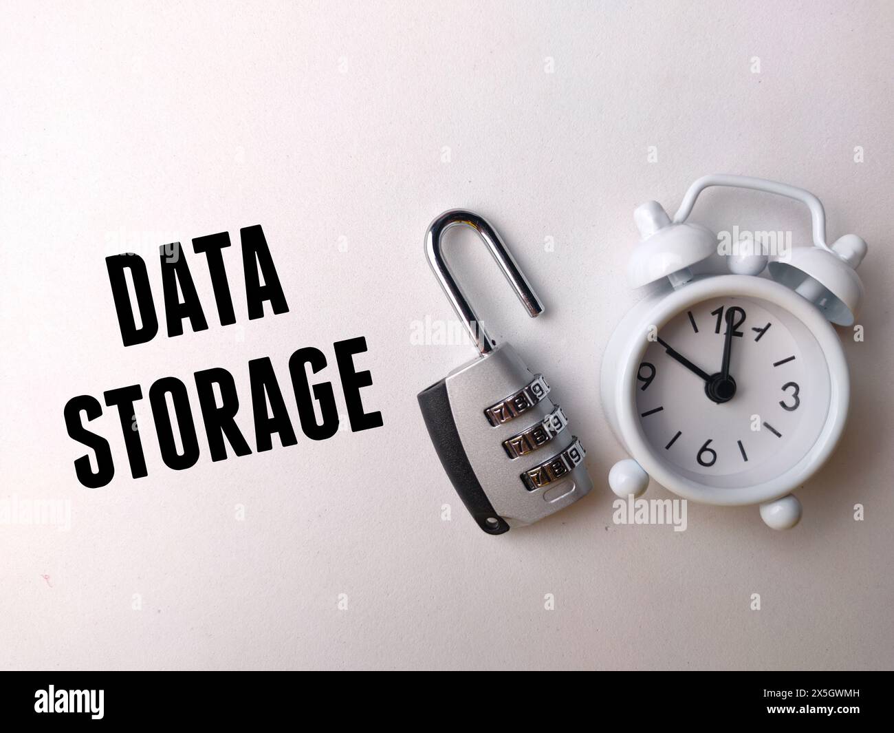 Top view padlock and calculator with text DATA STORAGE on white ...