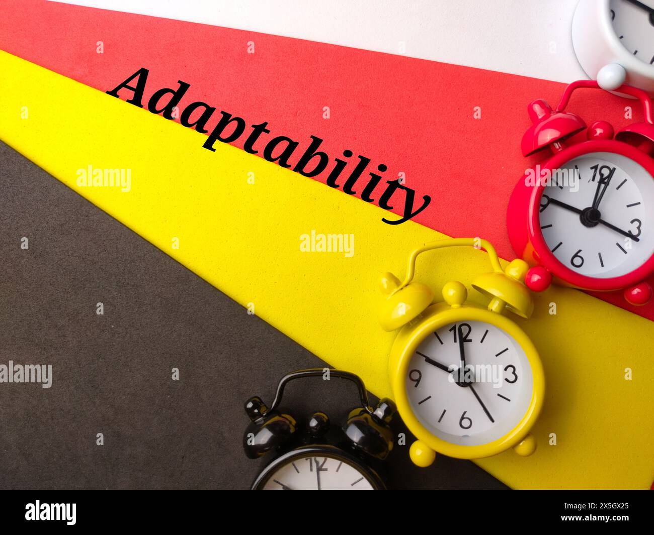 Top view clock with text Adaptability on colorful background Stock ...