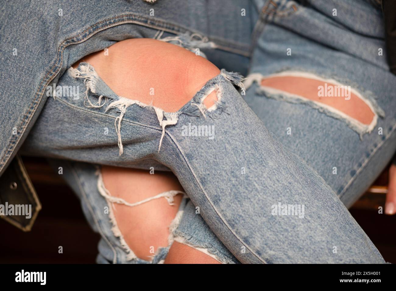Holes in denim jeans hi-res stock photography and images - Alamy