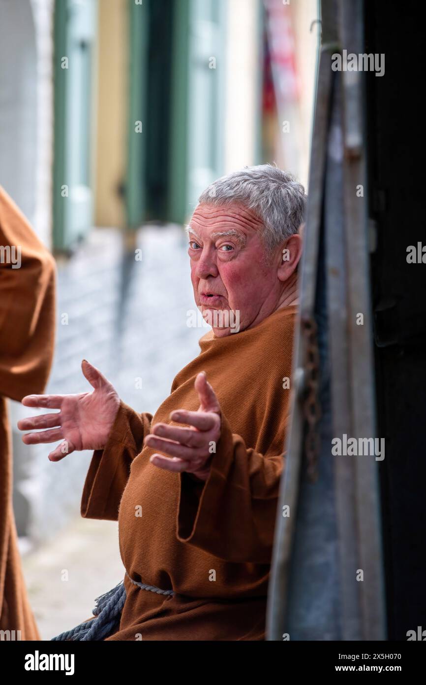 A man dressed as a Fryer explains his role before during the Catholic ...