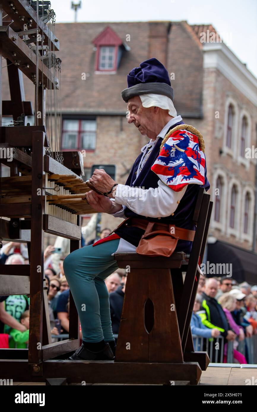 A bell ringer seen during the Catholic festival of the Procession of ...