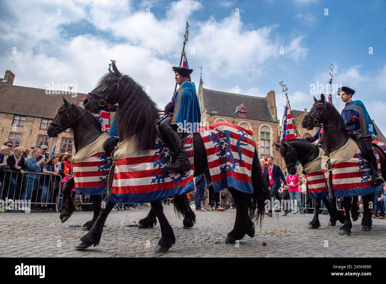 Men in medieval costumes on horse back seen during the Catholic ...