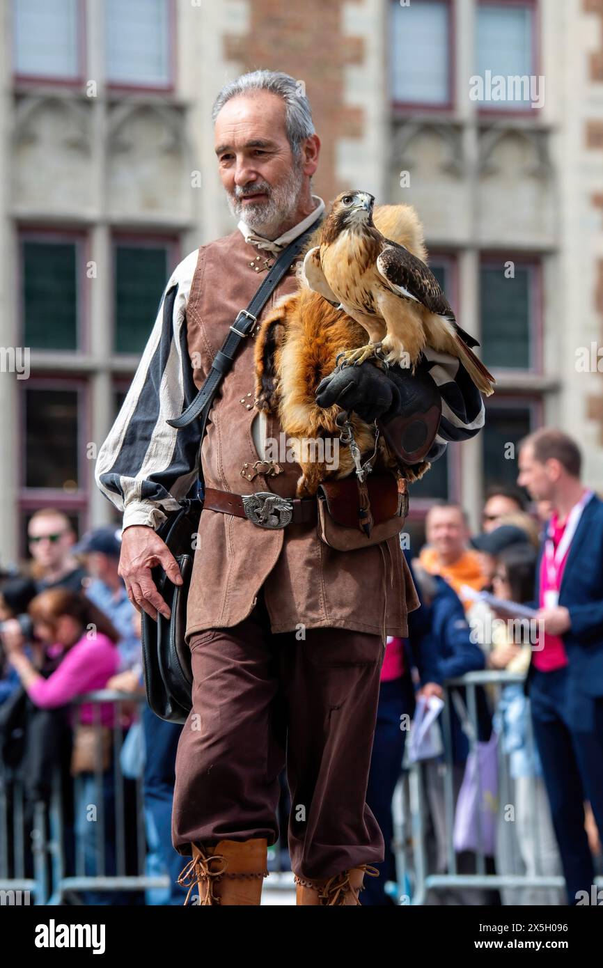 A falconer and his falcon seen during the Catholic festival of the ...