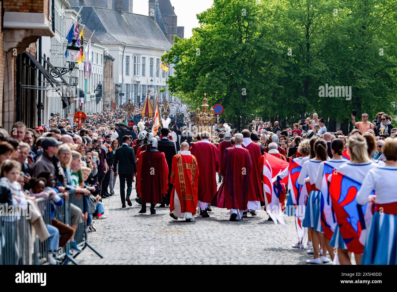 The procession moves through the town during the Catholic festival of ...