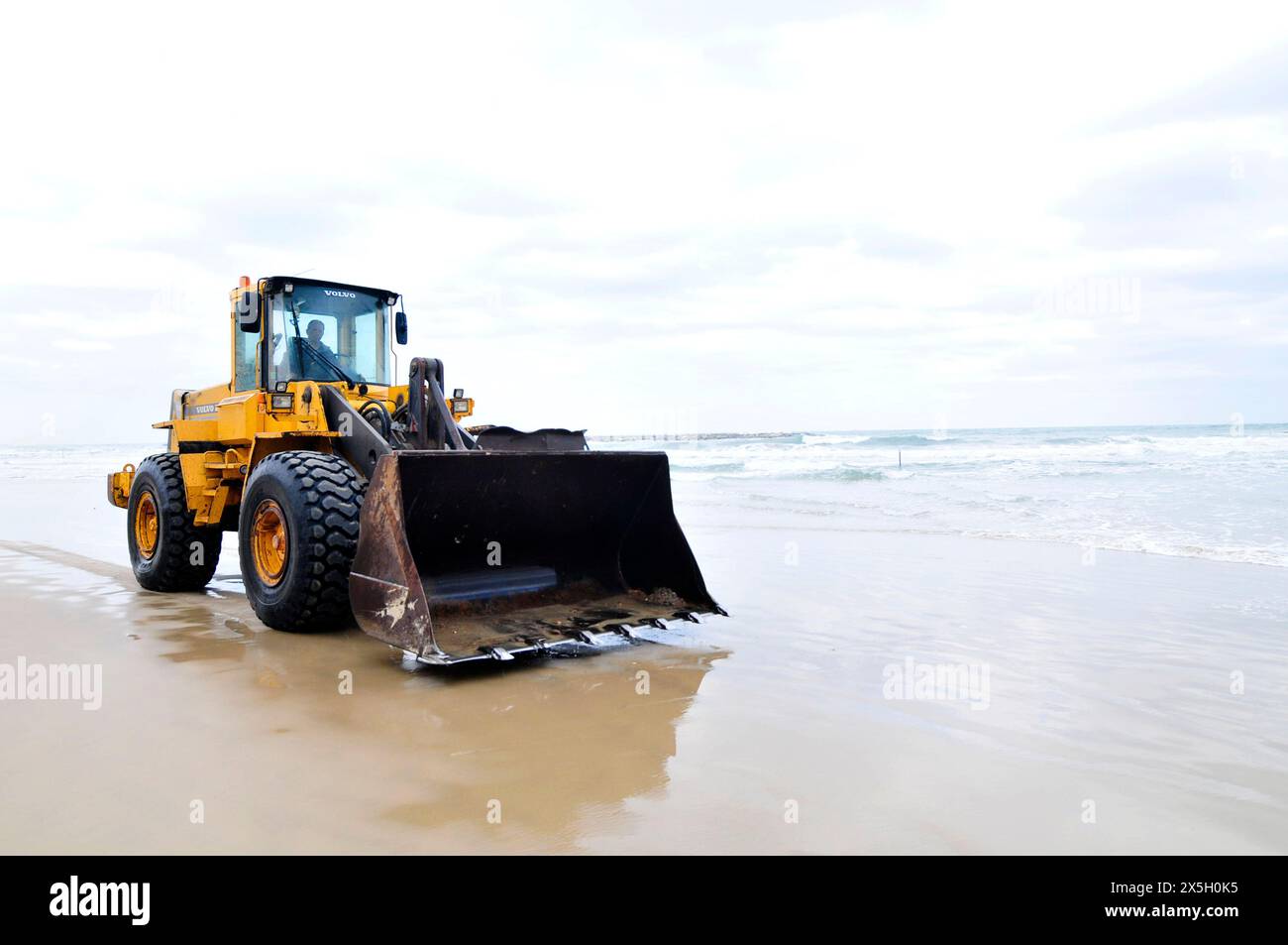 A large Volvo tractor on the beach in Tel-Aviv, Israel Stock Photo - Alamy