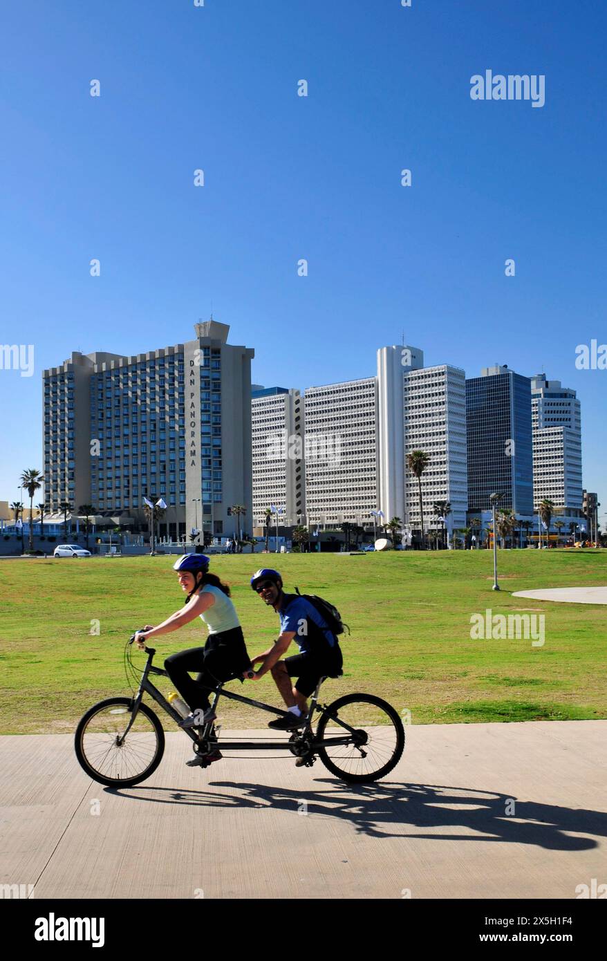 Riding a tandem bicycle by the Charles Clore Park in Tel-Aviv, Israel ...