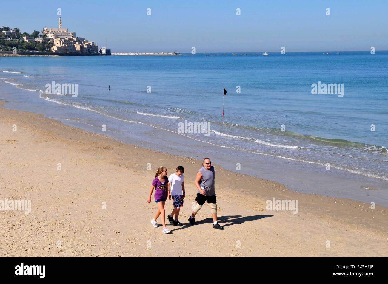 A family walking on the beach in Tel-Aviv, Israel Stock Photo - Alamy