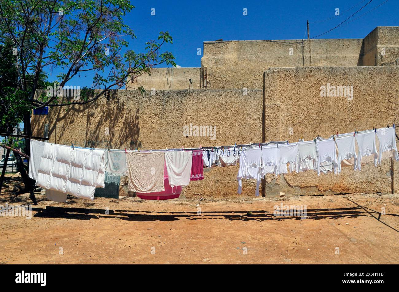 Drying washed laundry at a yard by an old house in Jaffa, Israel Stock ...