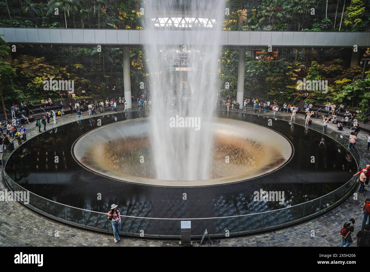 This image captures a stunning indoor waterfall cascading into a ...