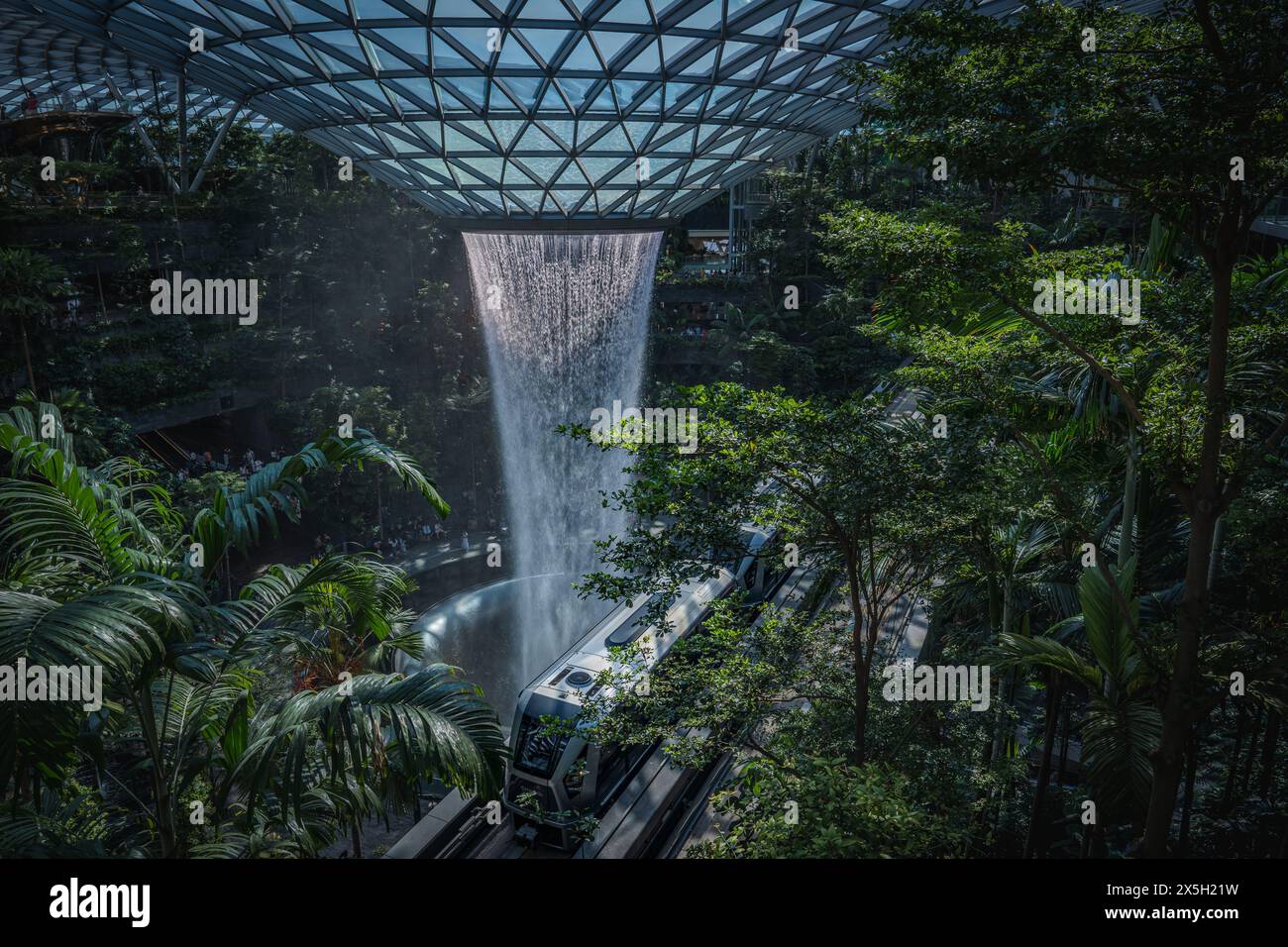 Stunning image featuring a large indoor waterfall cascading into a ...