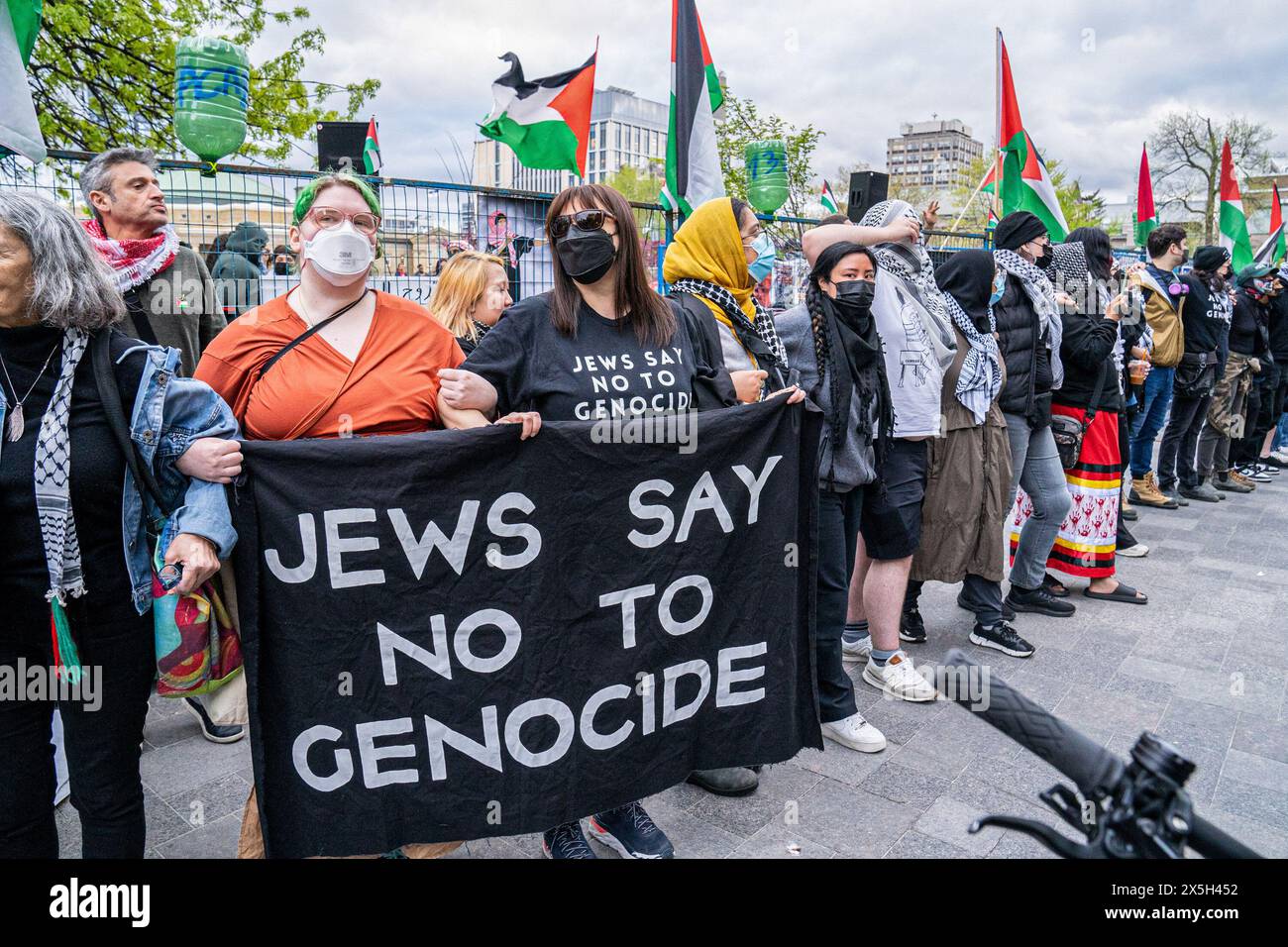 Jewish students supporting Palestinians hold a banner that says "Jews ...