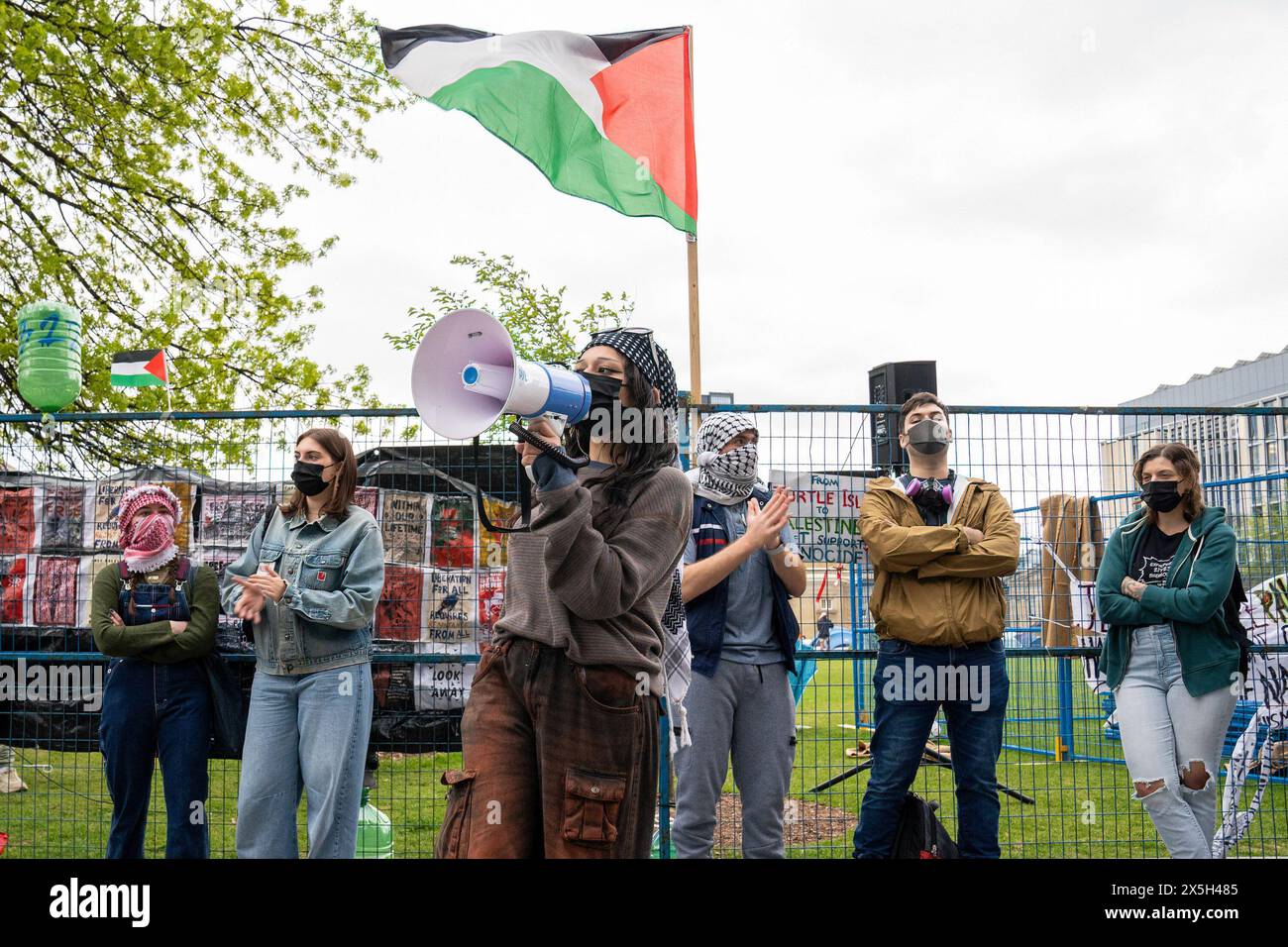 Pro-Palestinian student speaks on a megaphone during the rally. Pro ...