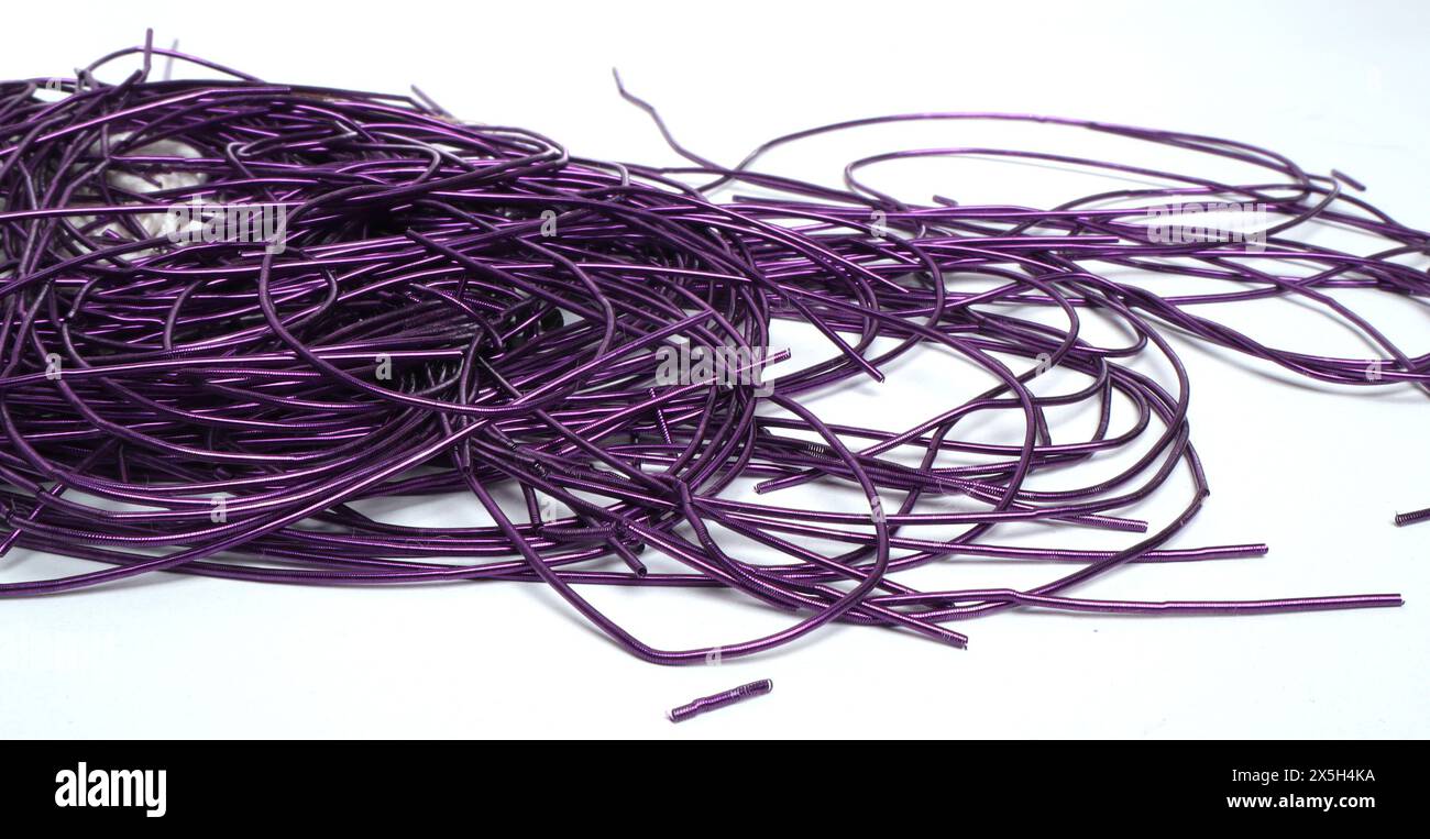 purple bullion wire isolated on white background Stock Photo - Alamy