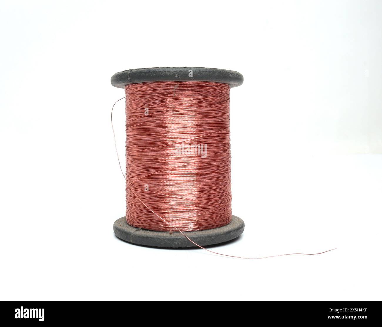 metallic embroidery thread reel isolated Stock Photo - Alamy