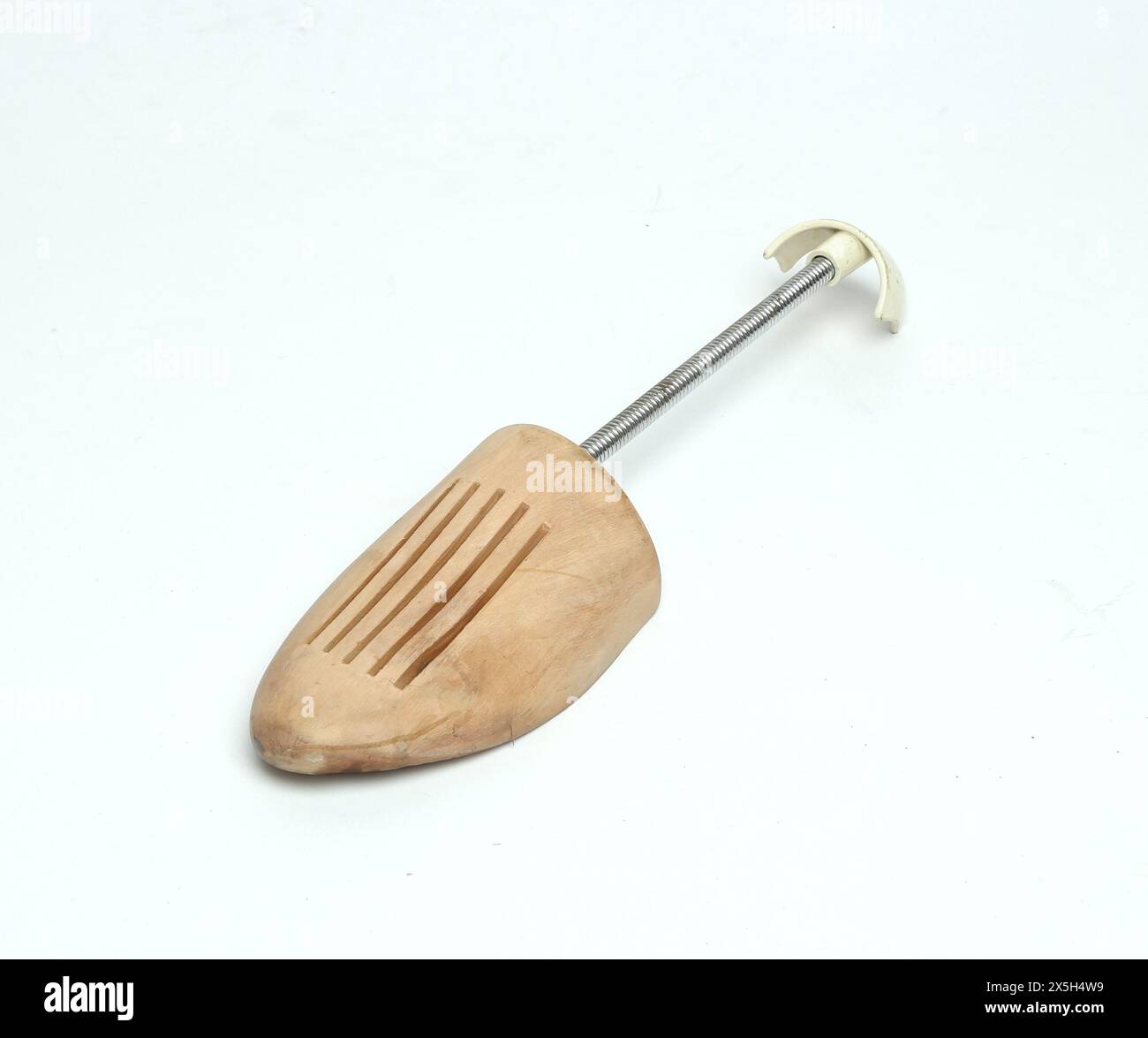 classy wooden shoe tree on white background Stock Photo - Alamy