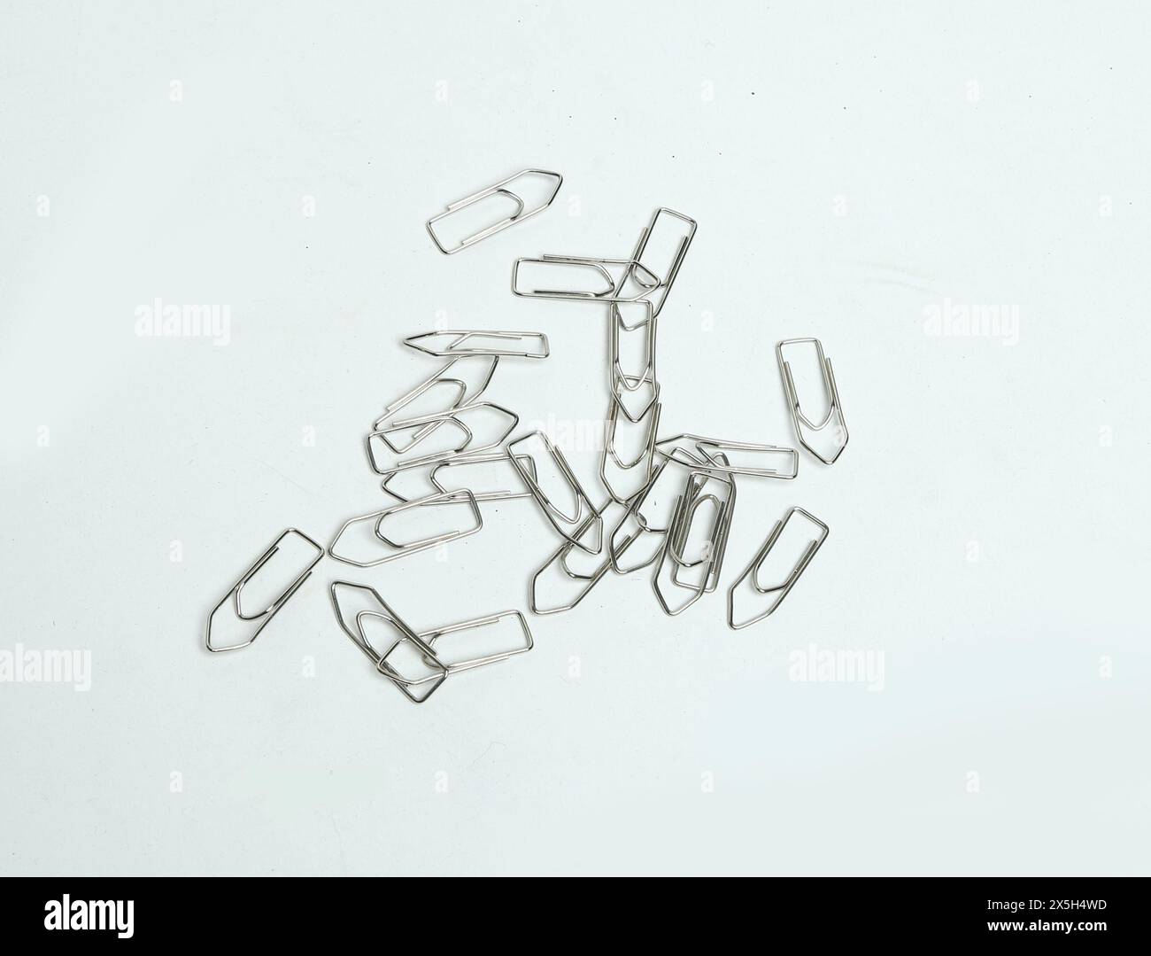 paper clamp-pin isolated on white background Stock Photo - Alamy