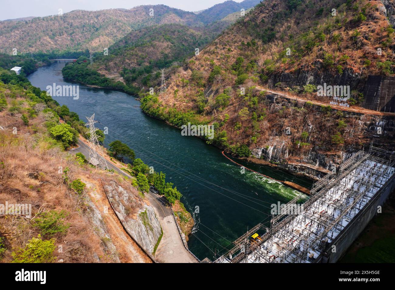 River dam amidst beautiful landscape with bridge, mountains and trees ...