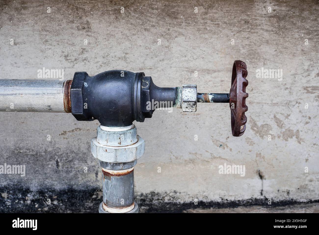 Rusty Industrial Water Pump and Tap on Wall Stock Photo - Alamy