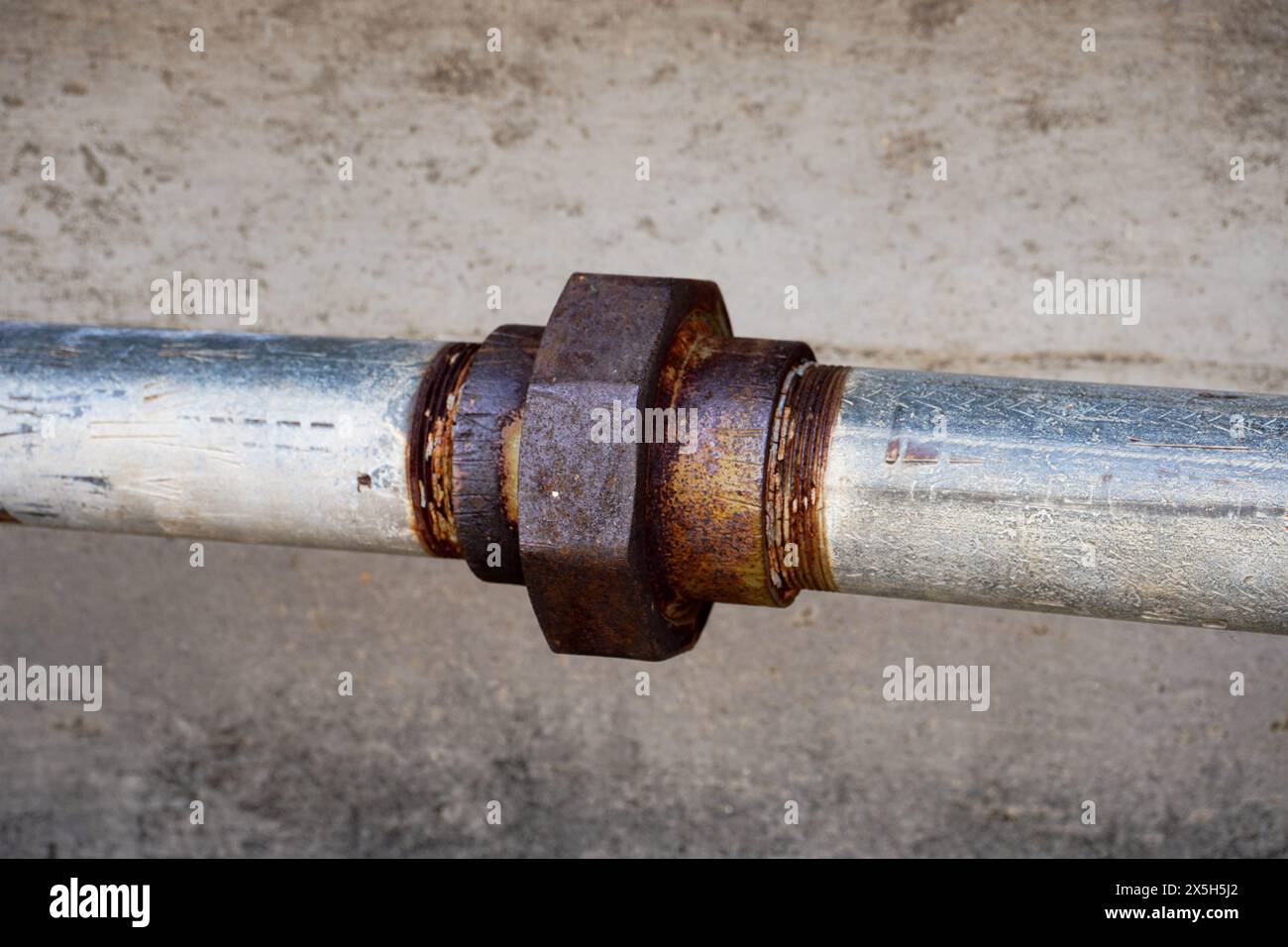 Rusty old metal pipe with valve and bolt Stock Photo - Alamy