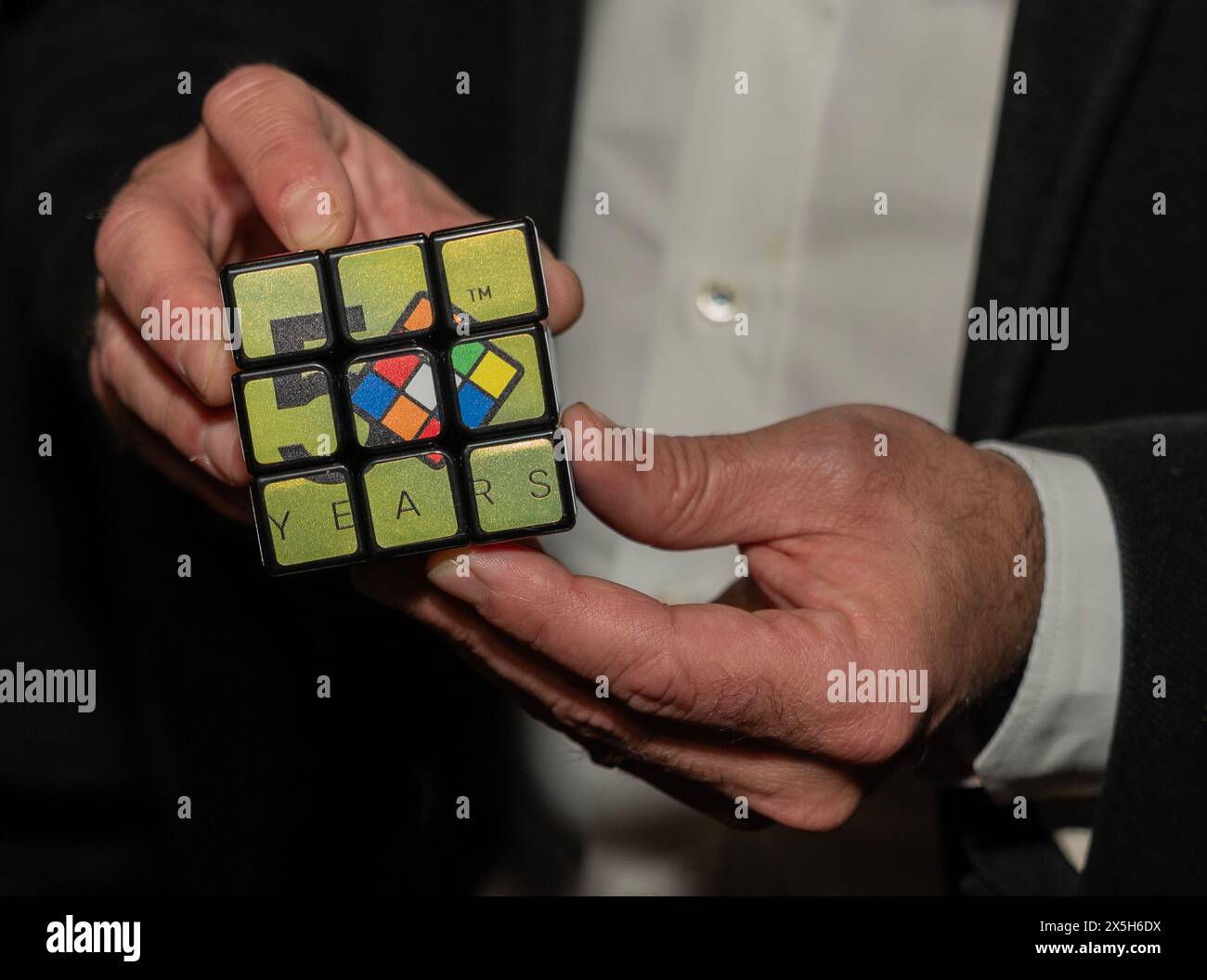 A man shows special editon of Rubik's Cube during People Magazine 50th ...