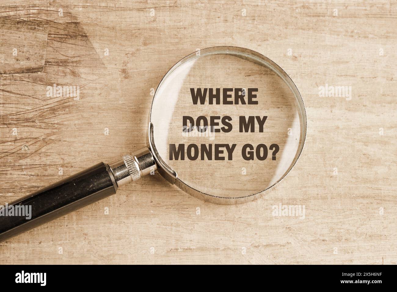 Question WHERE DOES MY MONEY GO visible through a magnifying glass on ...