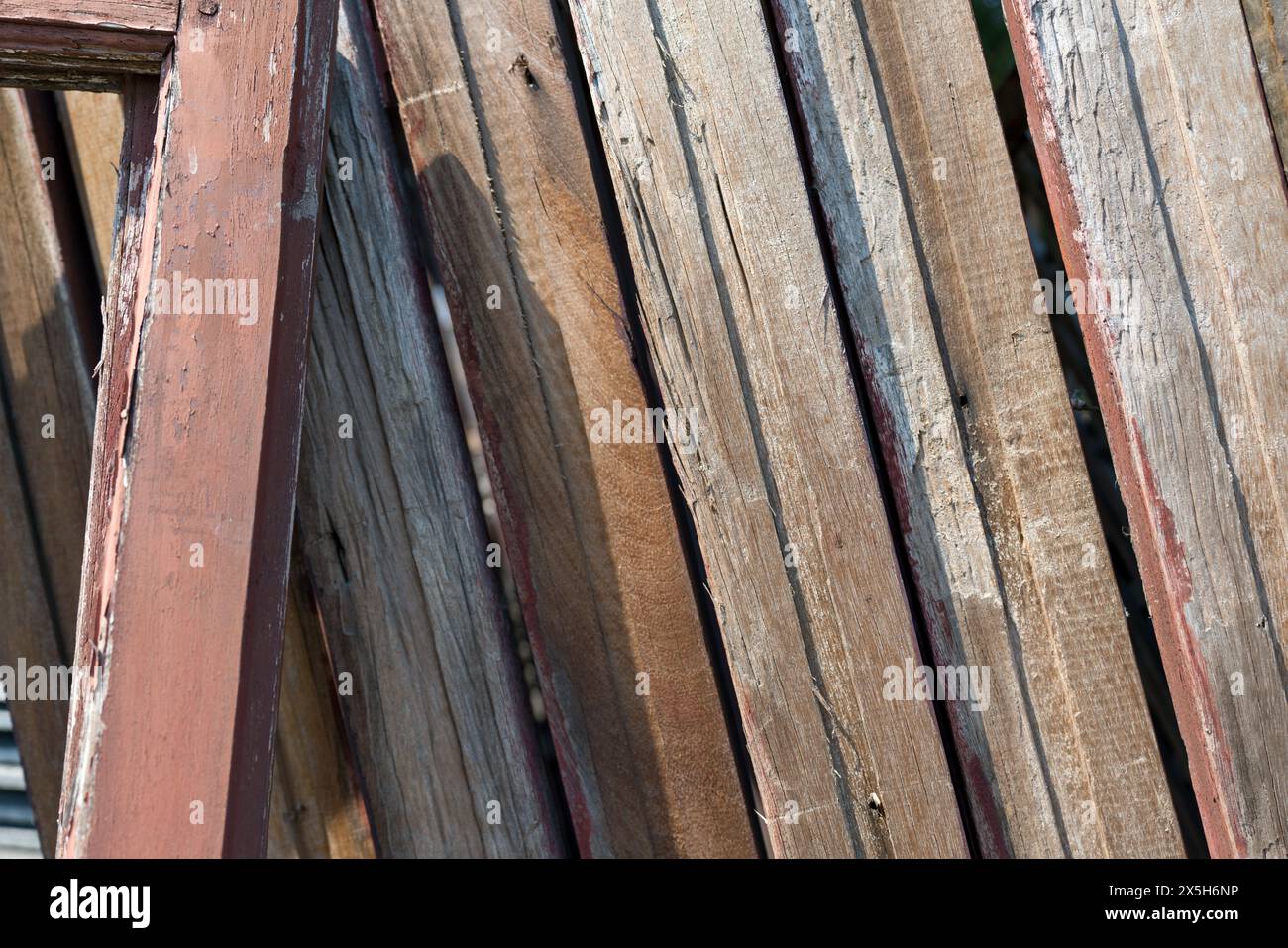 A collection of wooden plank with a worn, textured appearance. The wood ...