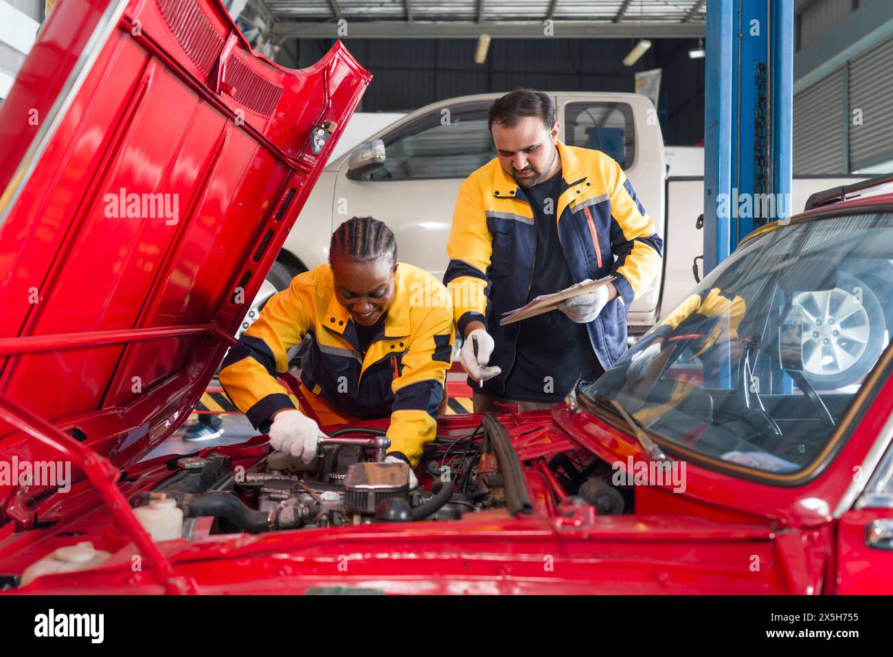 Skilled automotive mechanic engaged in hi-res stock photography and ...