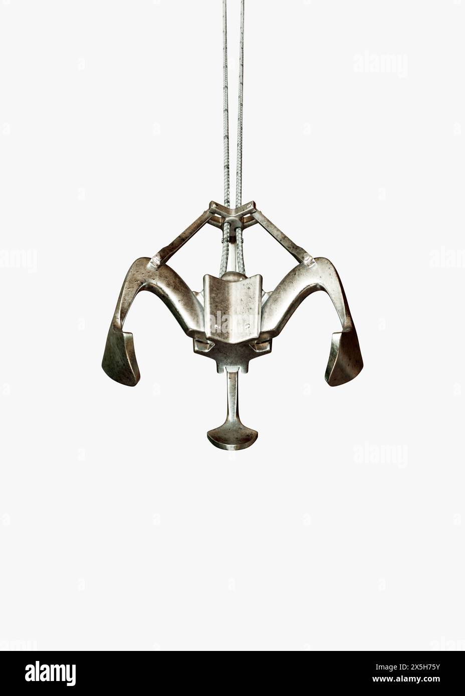 An open metal claw from a vintage arcade type grabber game connected to ...