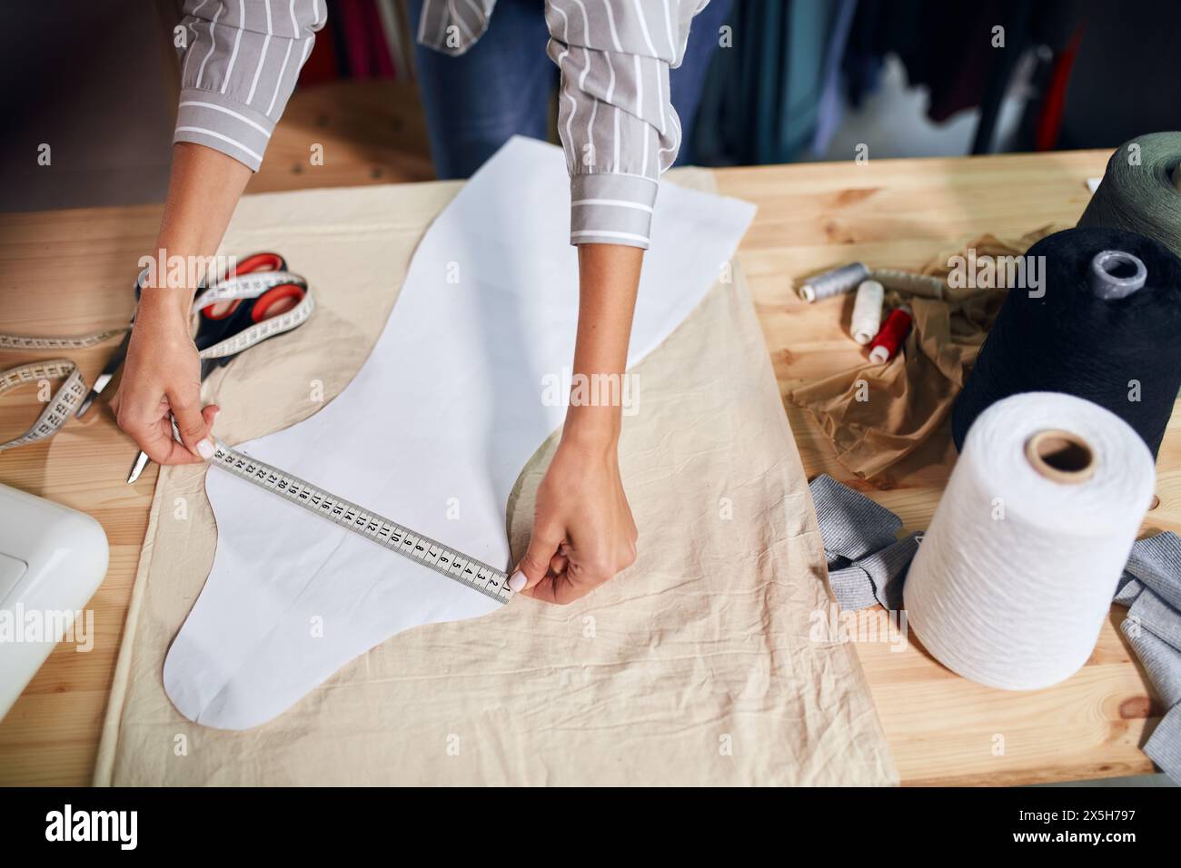 designer using measuring tape at studio, close up cropped photo Stock ...