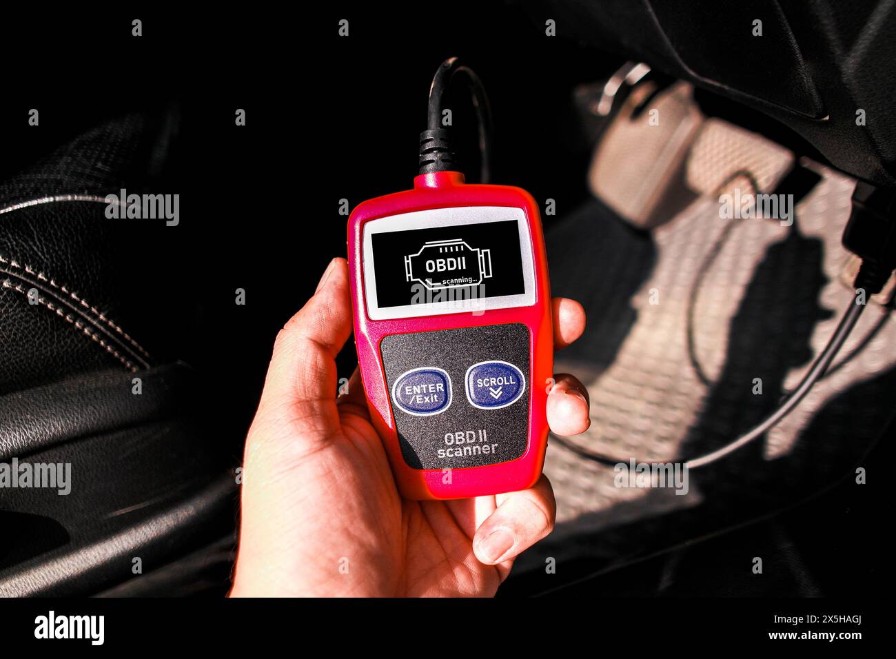 OBD scanner tool , OBD2 scanner in a car mechanic hand for car engine ...