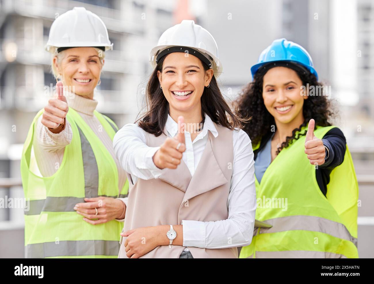 Construction, teamwork and portrait of women with thumbs up, helmet and ...