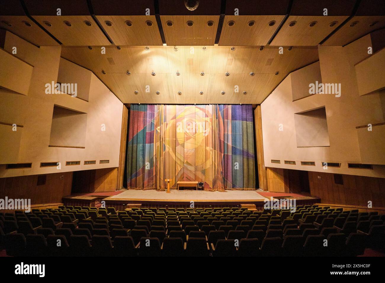 View of the main auditorium with colorful curtain. At the Soviet ...