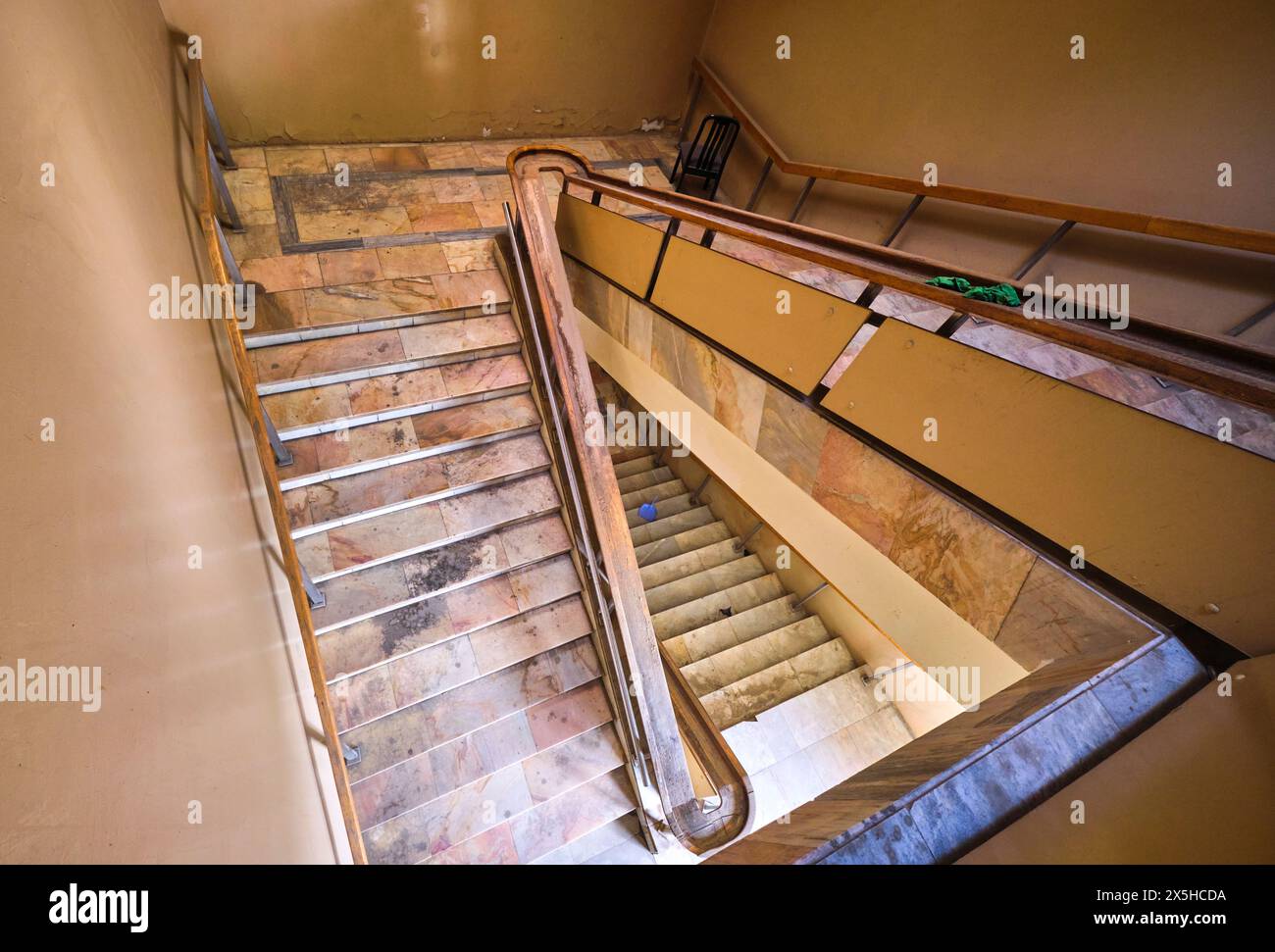 View of the simple, clean, marble stairwell steps. At the Soviet ...