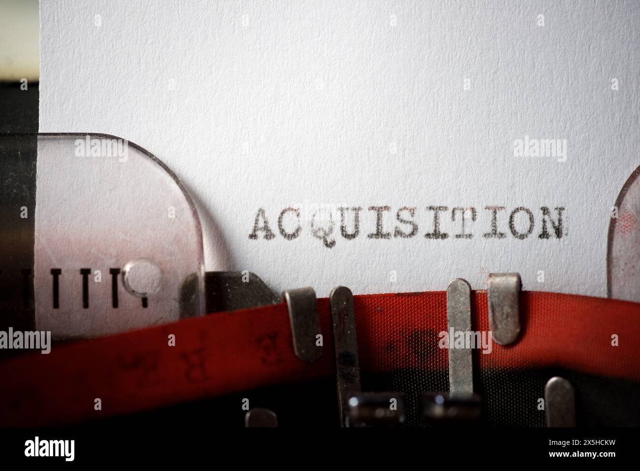 Acquisition word written with a typewriter Stock Photo - Alamy
