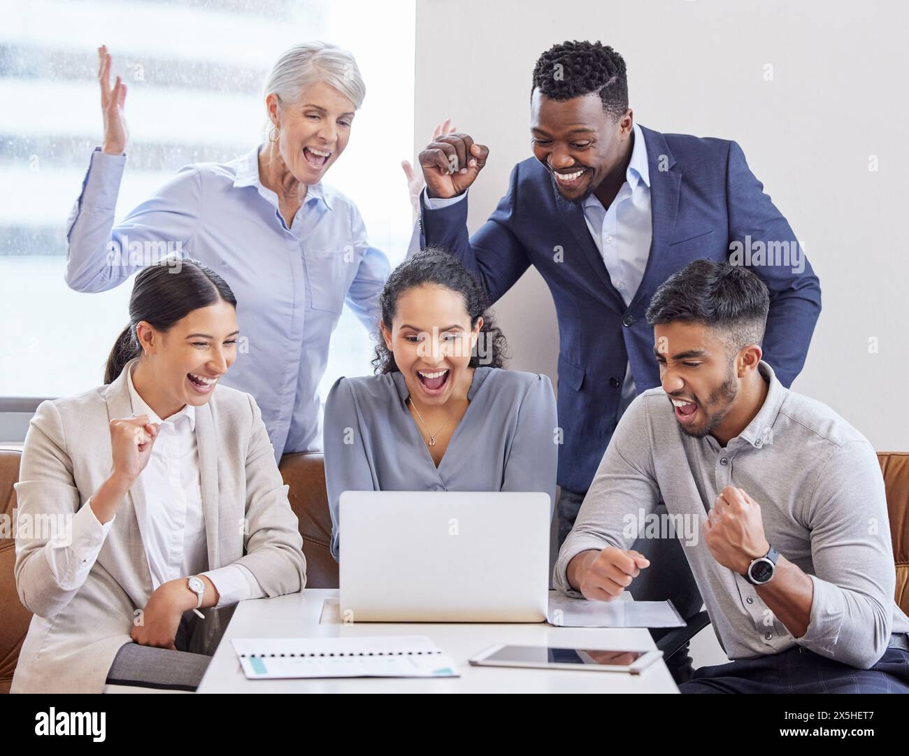 Business people, laptop and group with celebration, teamwork and email ...