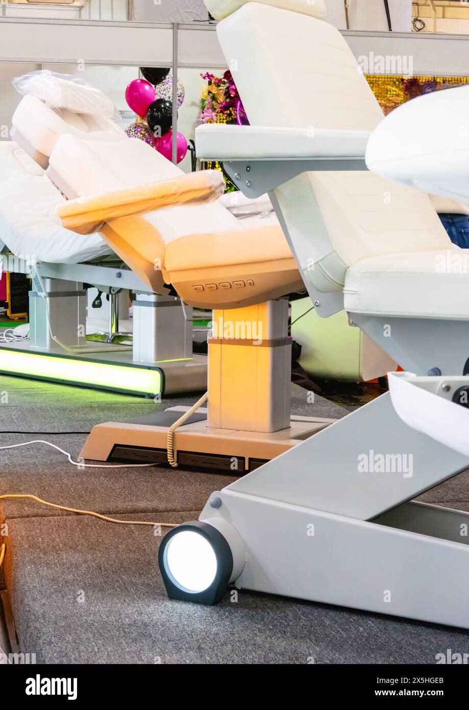 White chair for cosmetic procedures with electrically adjustable tilt ...