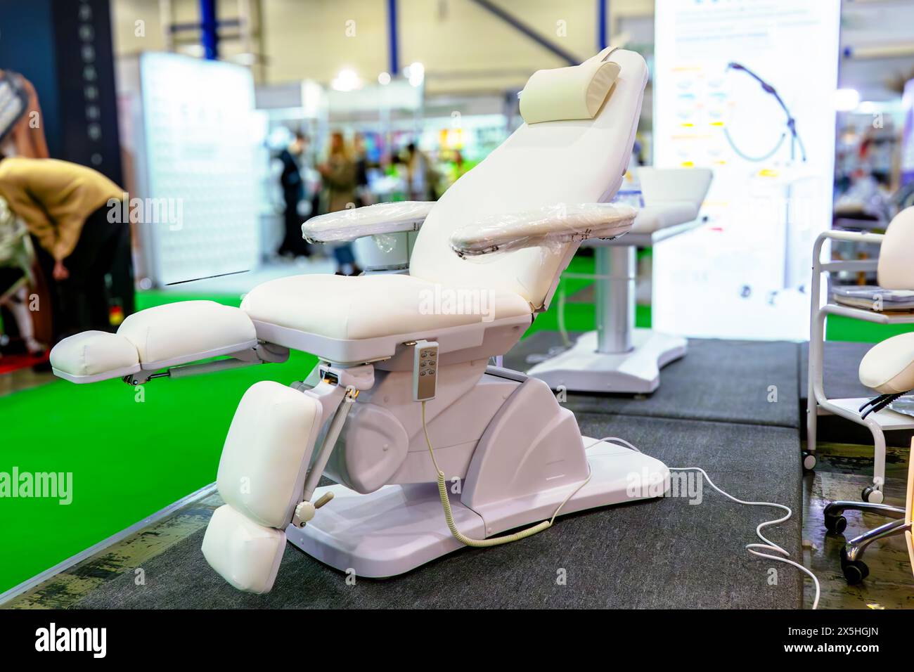 White chair for cosmetic procedures with electrically adjustable tilt ...