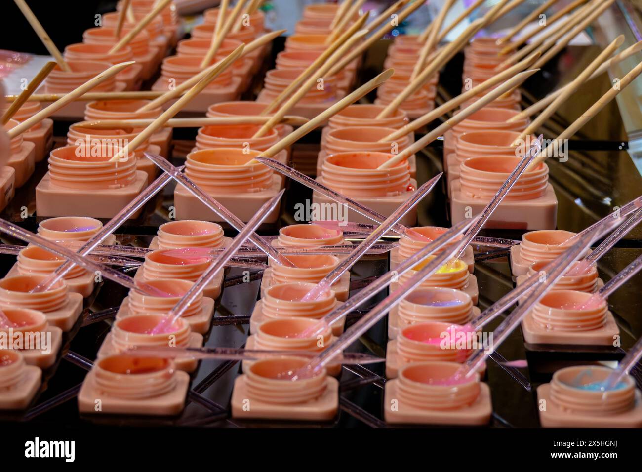 A variety of Modeling Gel in different colors in plastic jars. They are ...