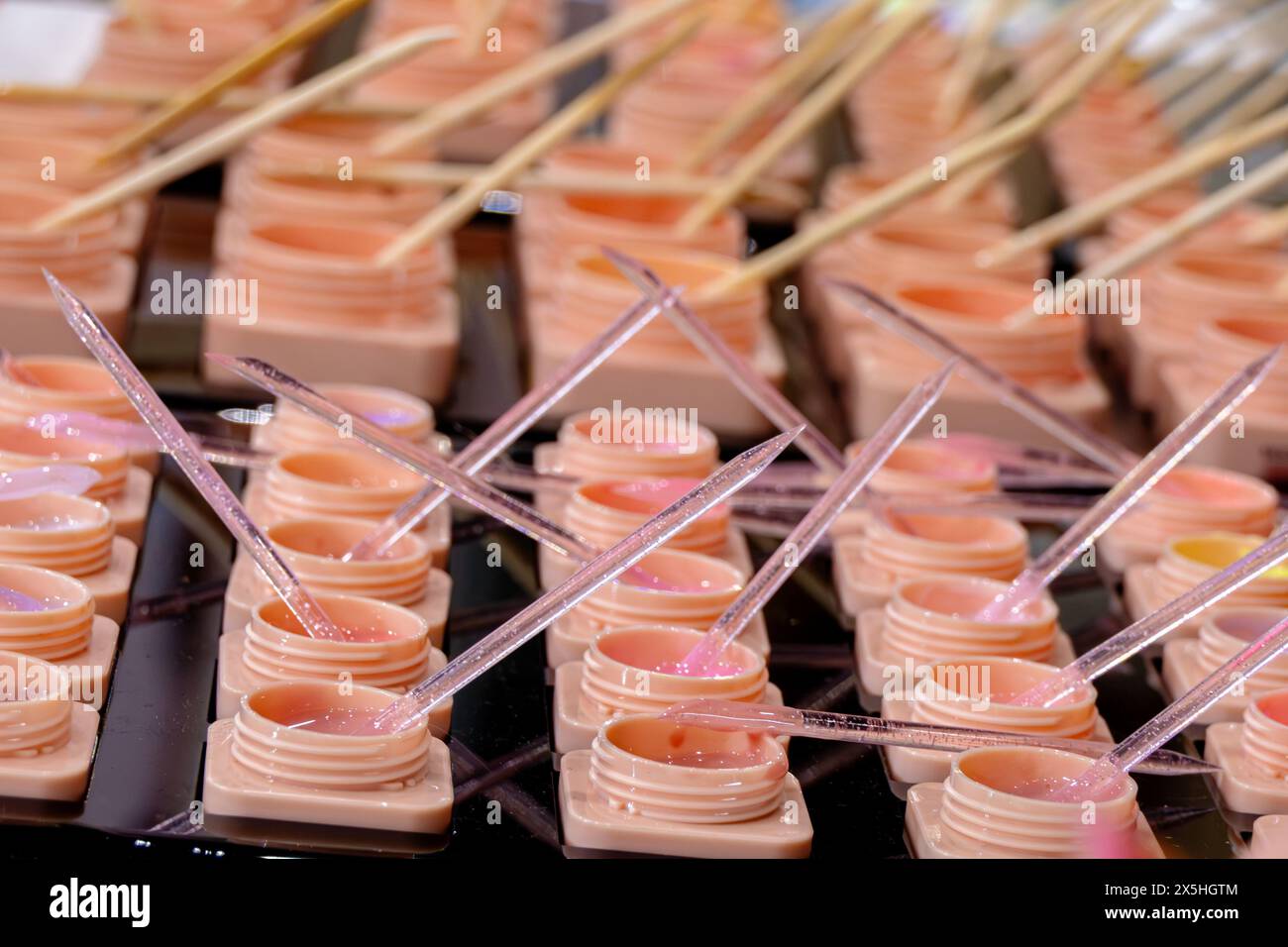 A variety of Modeling Gel in different colors in plastic jars. They are ...