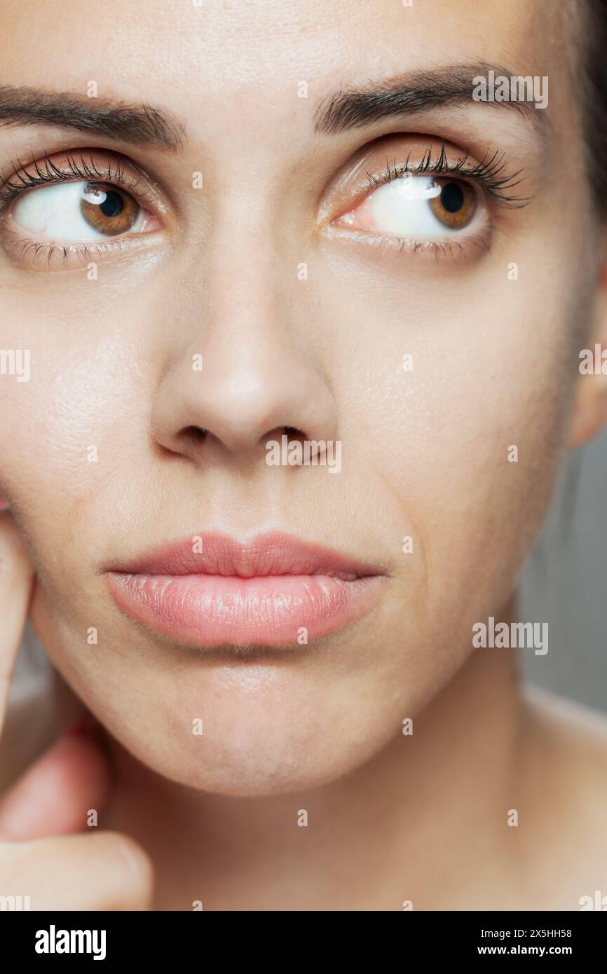 This Close Up Image Features A Young Woman With Captivating Hazel Eyes
