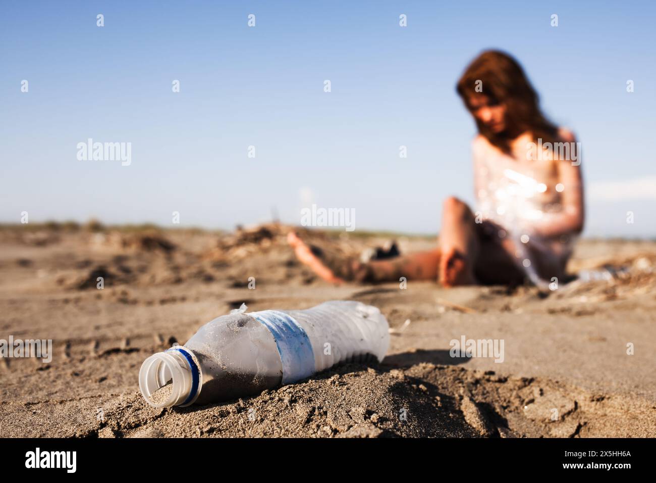 Sad woman sitting on beach hi-res stock photography and images - Alamy