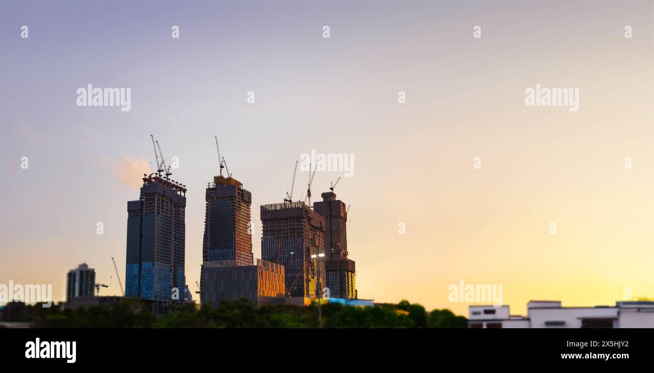 the luffing tower crane at the narrow construction site building in the ...