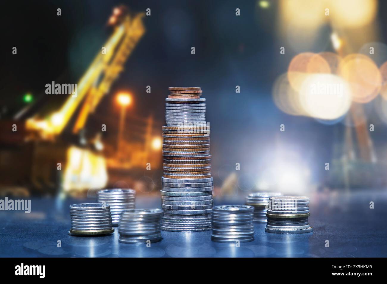 The funds for a construction site, there is a tower crane and coins are ...