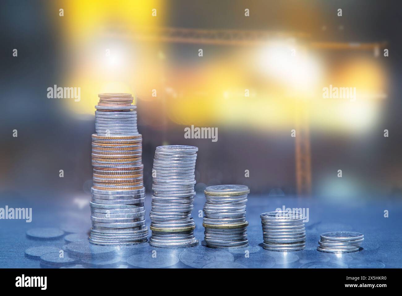 The funds for a construction site, there is a tower crane and coins are ...