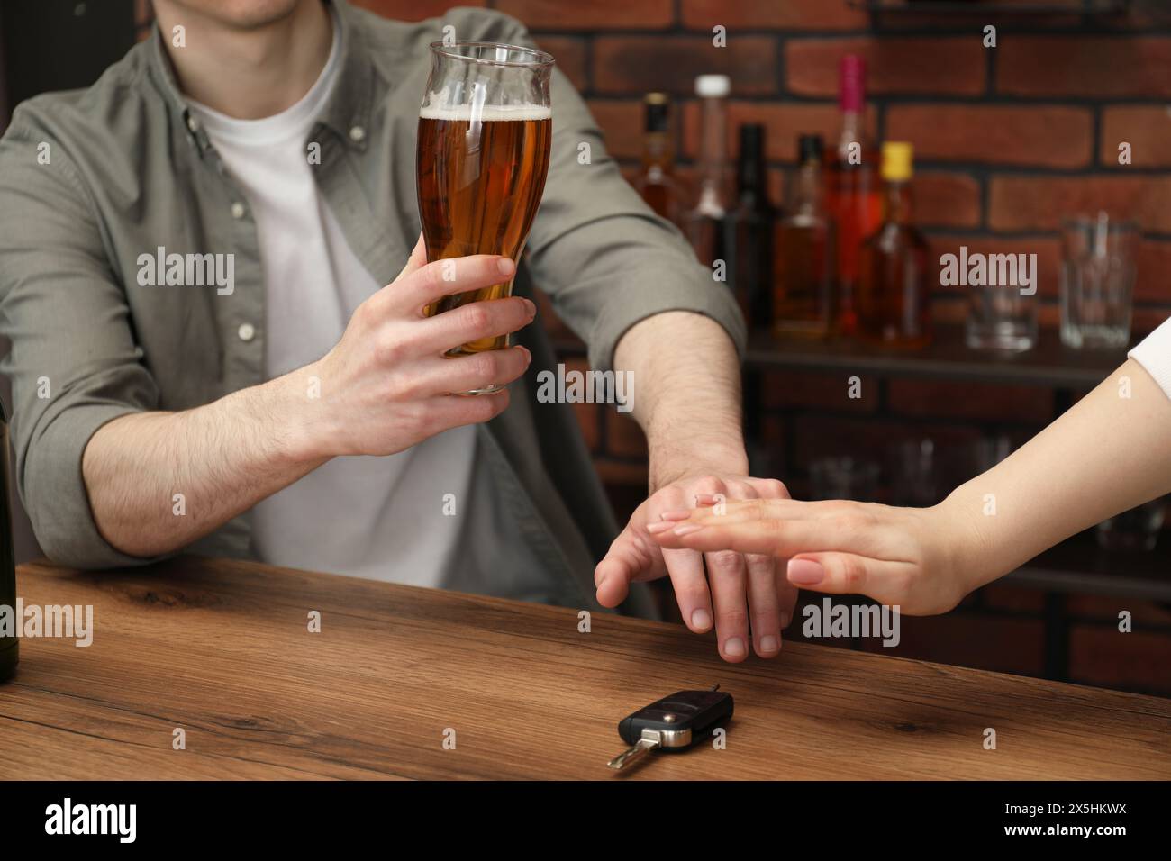 Woman stopping drunk man from taking car keys, closeup. Don't drink and ...