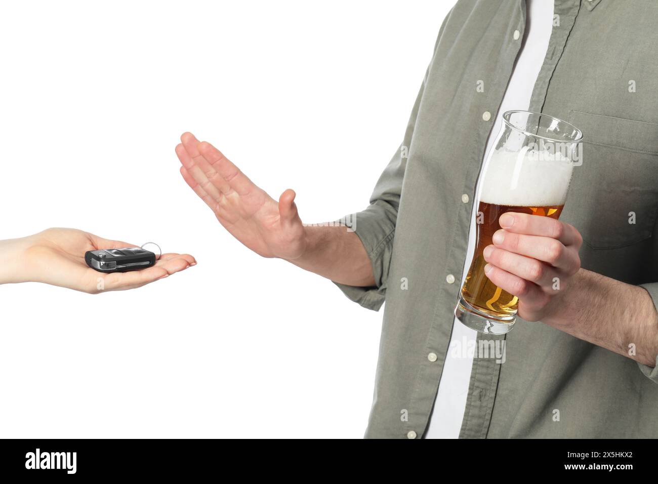 Man with glass of beer refusing drive car while woman suggesting him ...